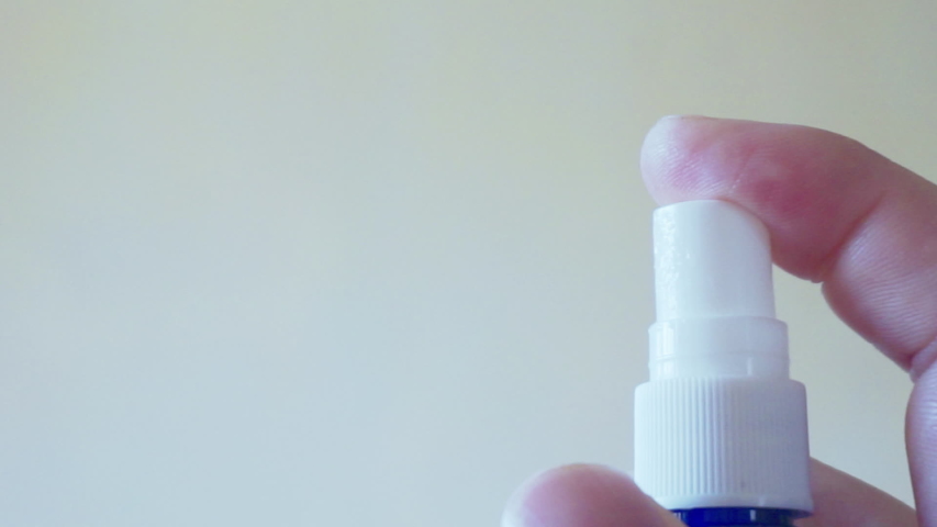 finger presses on spray bottle close-up Stock Footage Video (100% ...