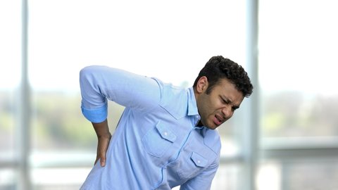 Young Indian Man Suffering Back Pain Stock Footage Video (100% Royalty ...