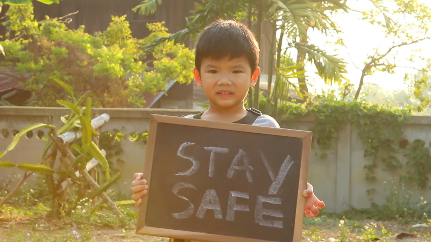 child showing stay safe board Stock Footage Video (100% Royalty-free ...