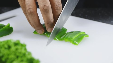 Slicing Green Capsicum On White Chopping Stock Footage Video (100% ...