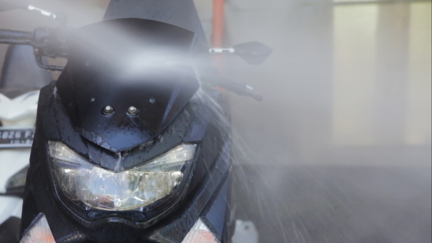 Washing Motorcycle with Water Spray Stock Footage Video (100% Royalty ...