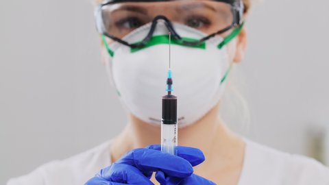 Female Doctor Slowly Squeezing Blood Syringe Stock Footage Video (100% ...