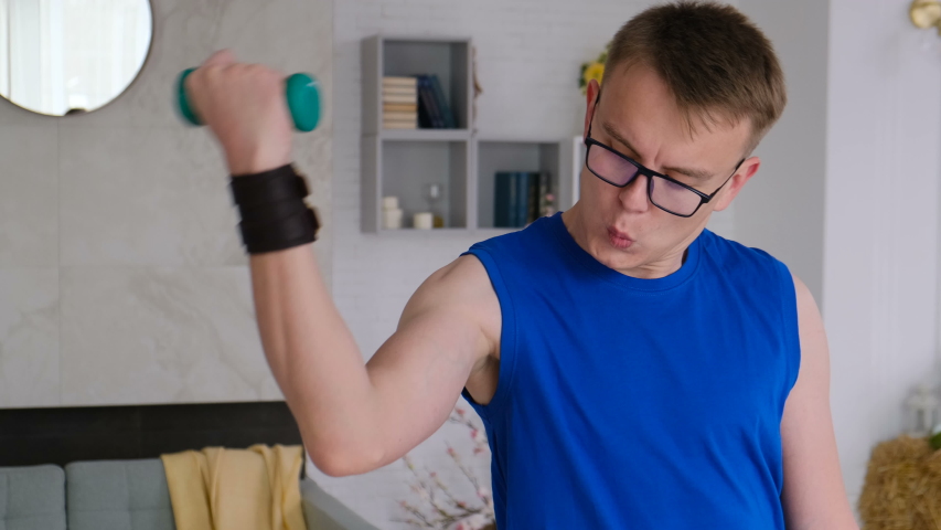 funny guy shaking his little dumbbell's Stock Footage Video (100% ...