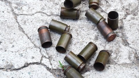 Pistol Bullet Casings Fall Concrete Slab Stock Footage Video (100% ...