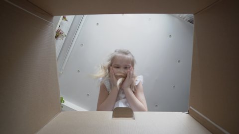 Small Girl Looks Box Surprised Happy Stock Footage Video (100% Royalty ...