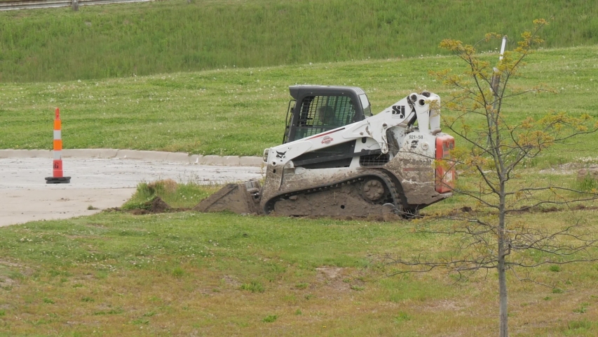 Bobcat Digging Grass Stock Video Footage - 4K and HD Video Clips ...