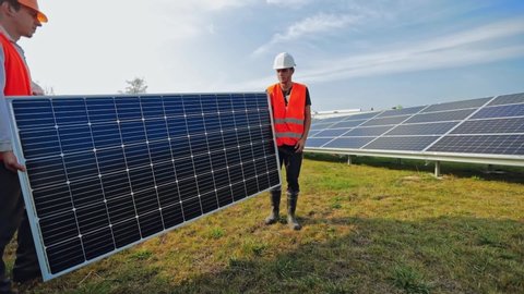 Workers Carry Solar Panel Install On Stock Footage Video (100% Royalty-free) 1052440807 ...