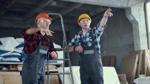 Construction Site Two Builders Constructors Walking Stock Footage Video ...