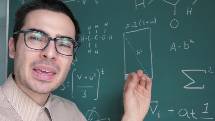 male caucasian teacher explaining mathematical equations Stock Footage ...