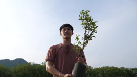 Asian Man Carrying Plant Walking Stock Footage Video (100% Royalty-free ...