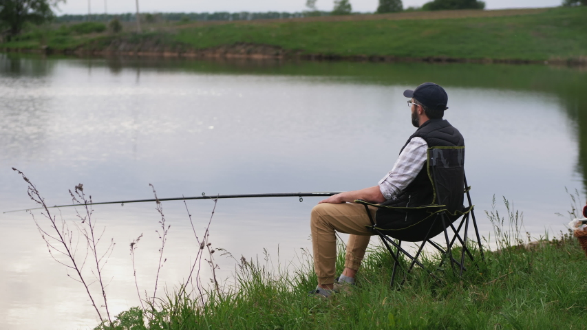 Fisherman Sitting On a Chair Stock Footage Video (100% Royalty-free ...