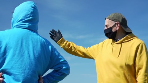 Man Mask Yellow Hoodie Explains Person Stock Footage Video (100% ...