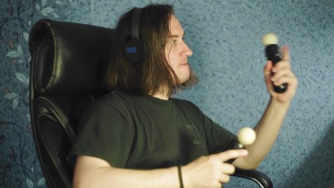 Guy Holding Motion Controllers Playing Video Stock Footage Video (100% ...