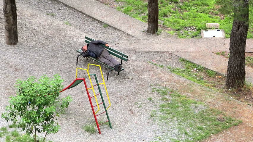 Tramp Sleeping On Park Bench Stock Footage Video (100% Royalty-free ...