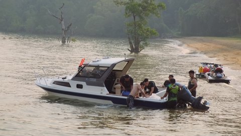 People Bailing Water Out Motor Boat Stock Footage Video (100% Royalty ...