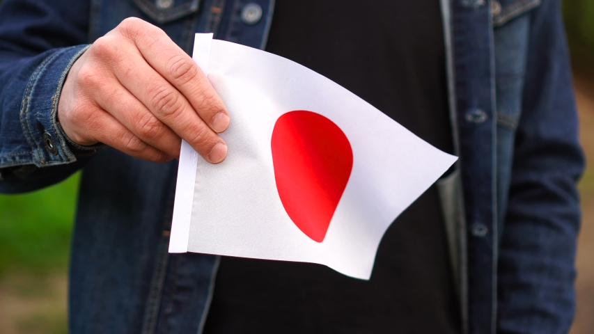 man holding japanese flag outdoors independence Stock Footage Video ...