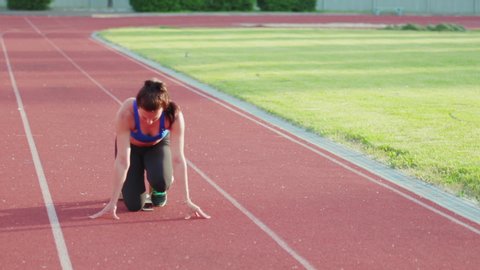 Female Athlete Starting Her Sprint On Stock Footage Video (100% Royalty ...