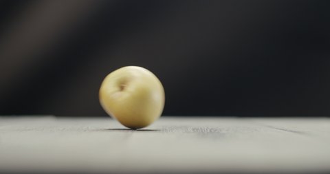 Yellow Apple Rolling Across Table Stock Footage Video (100% Royalty ...