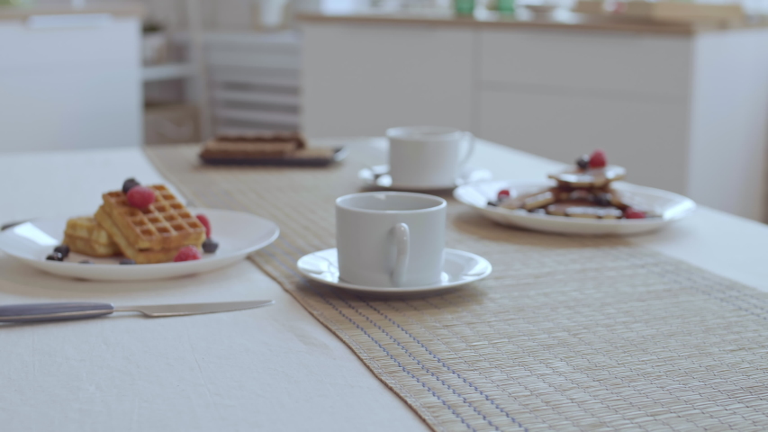 panning female hand putting plate two Stock Footage Video (100% Royalty ...