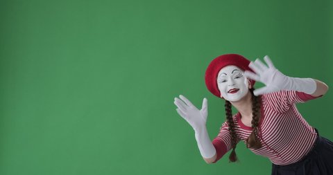 Mime Woman Waving Hand Over Green Stock Footage Video (100% Royalty ...