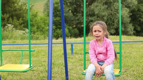 Little Girl Crying Sitting On Swing Stock Footage Video (100% Royalty ...