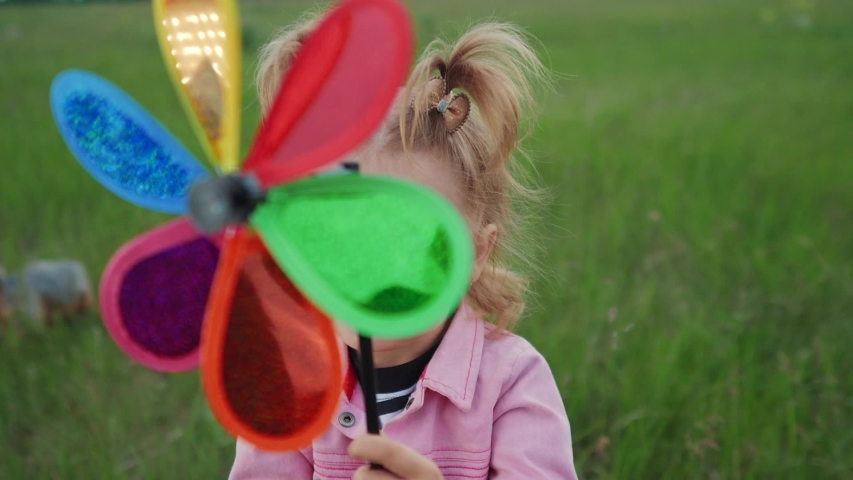 little daughter girl kid play pinwheel Stock Footage Video (100% ...