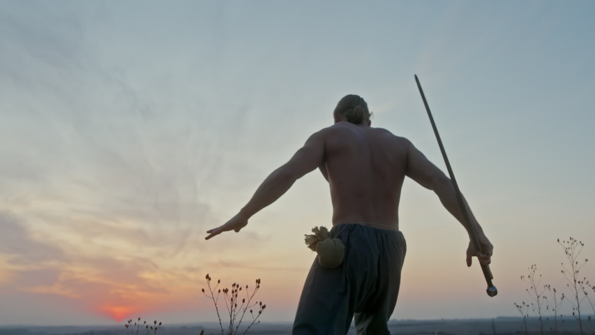 muscular shirtless man sword practicing slashing Stock Footage Video ...