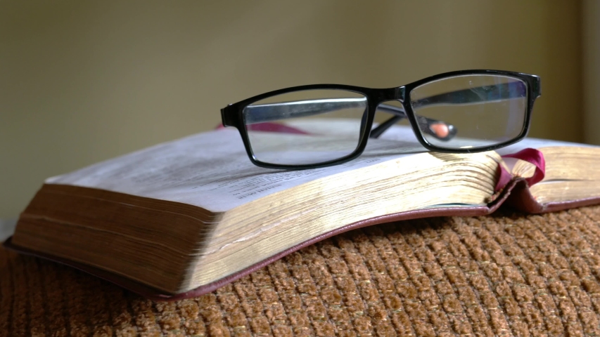 open bible spectacles reading glasses on Stock Footage Video (100% ...