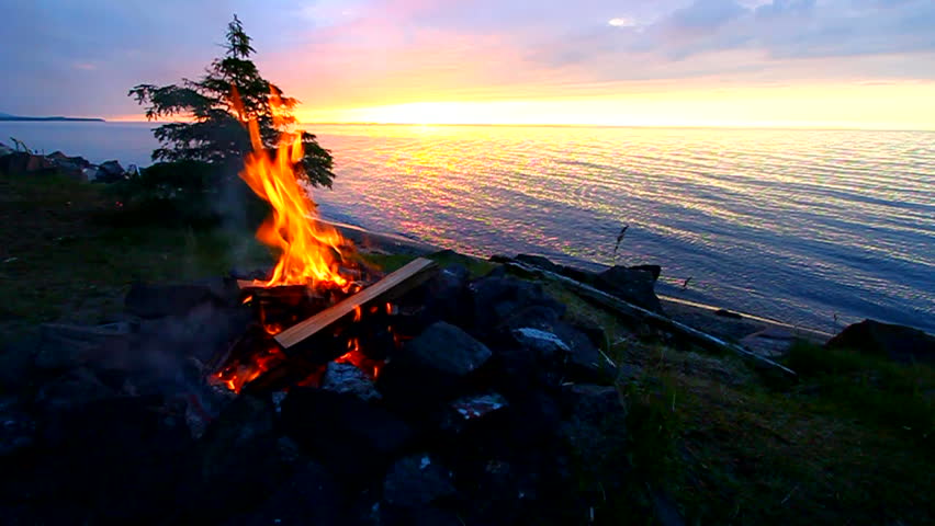 Sunset Camp Fire Along a Stock Footage Video (100% Royalty-free ...