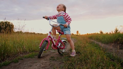 Girl On Bicycle Throws Both Legs Stock Footage Video (100% Royalty-free ...
