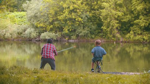 Two Brothers On Fishing Man Pulling Stock Footage Video (100% Royalty ...