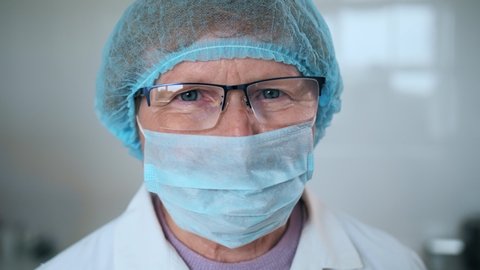 portrait professional surgeon taking off surgical Stock Footage Video ...