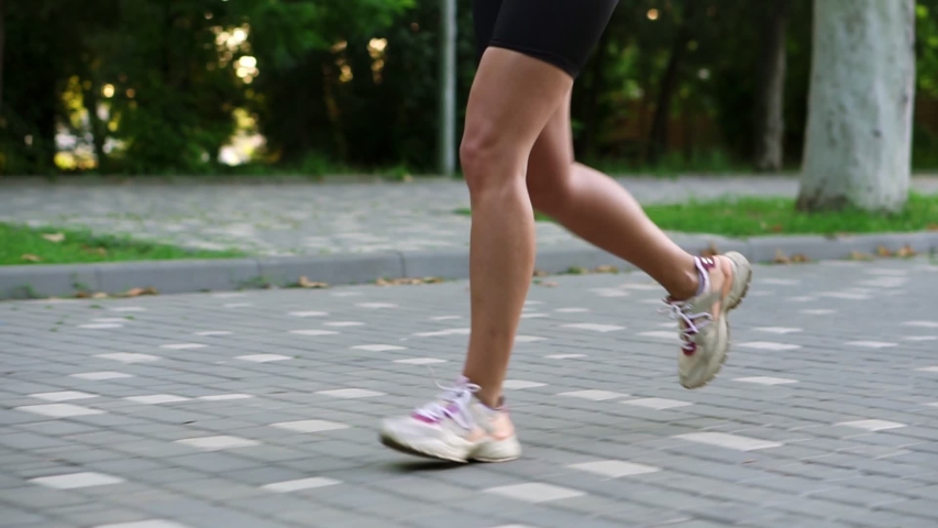 closeup female athlete's feet running park Stock Footage Video (100% ...