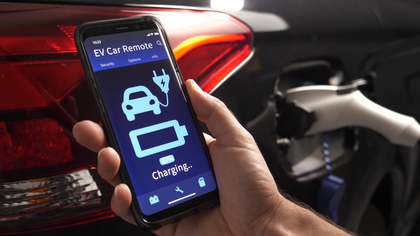 mobile phone showing charging status ev Stock Footage Video (100% ...