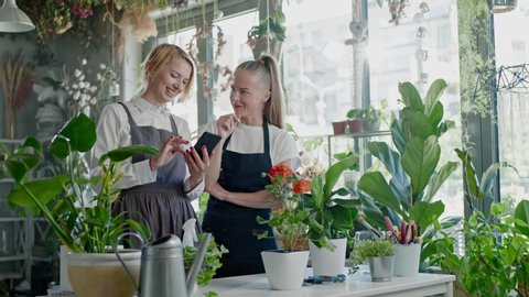 Florist Assistant Discuss New Order Through Stock Footage Video (100% ...