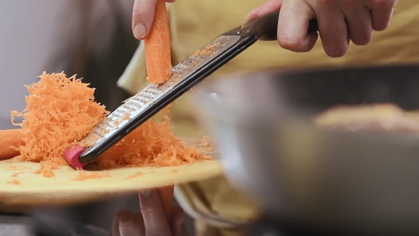 grating fresh carrot grater kitchen Stock Footage Video (100% Royalty ...