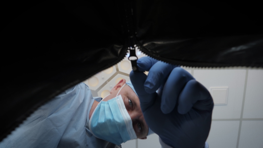 doctor pathologist closes plastic bag dead Stock Footage Video (100% ...