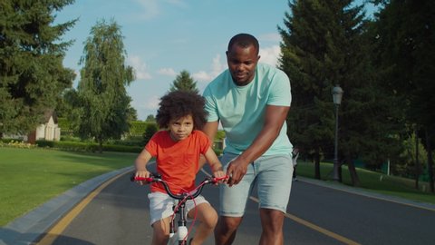 African american riding bike Stock Video Footage - 4K and HD Video ...