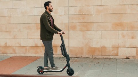 e-scooter rider man ride sharing rent Stock Footage Video (100% Royalty ...