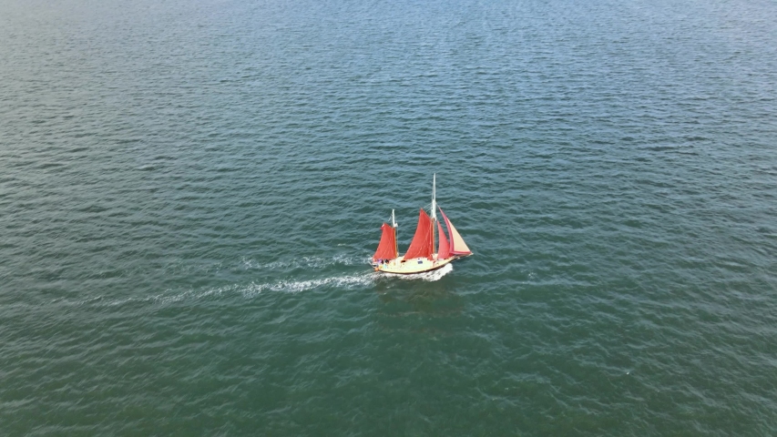 red sail boat sailing front mountains Stock Footage Video (100% Royalty ...