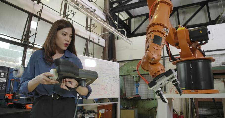 young asian female industrial robotics engineer Stock Footage Video ...