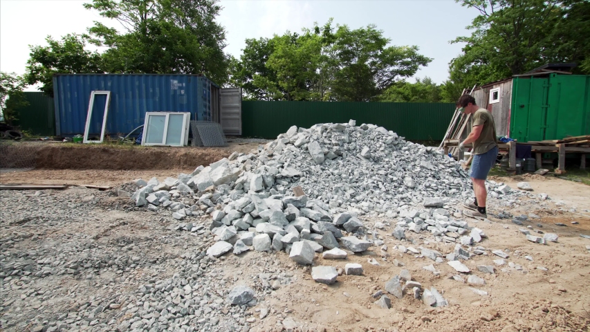 man breaking stones heavy hammer preparing Stock Footage Video (100% ...