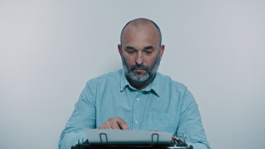 In the office working man concentrated typing some notes on the ...