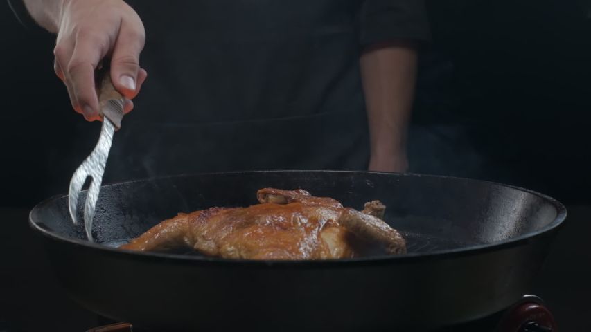 chef flips whole grilled chicken large Stock Footage Video (100% ...