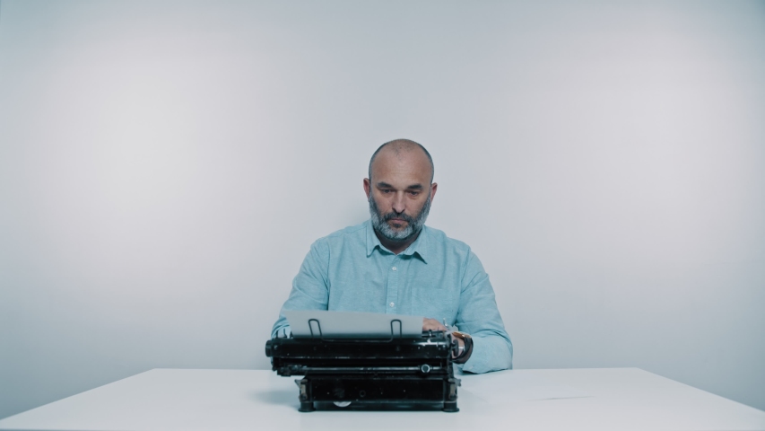 In the office working man concentrated typing some notes on the ...