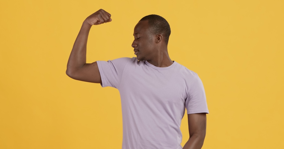 strong black man showing his biceps Stock Footage Video (100% Royalty ...
