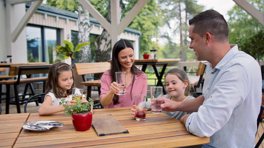 family children outdoors on terrace restaurant Stock Footage Video (100 ...