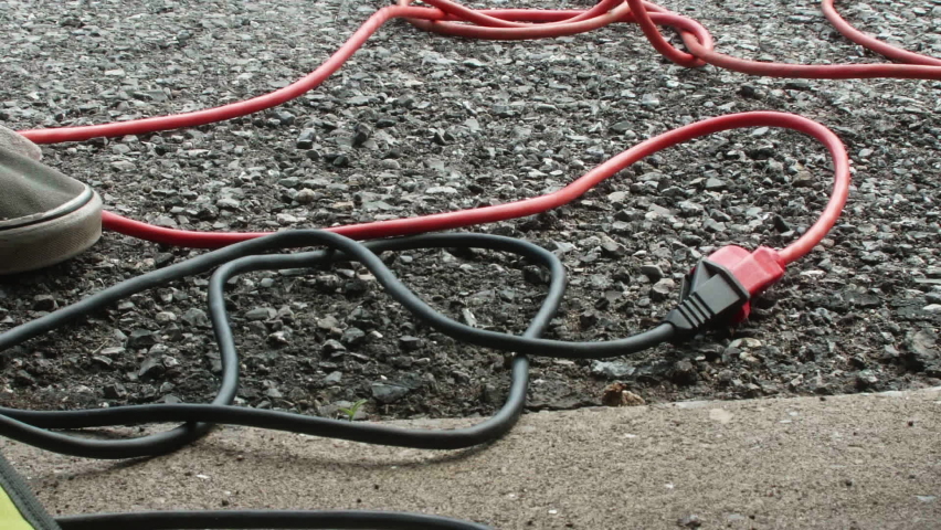 man unplugging power tool extension cord Stock Footage Video (100% ...