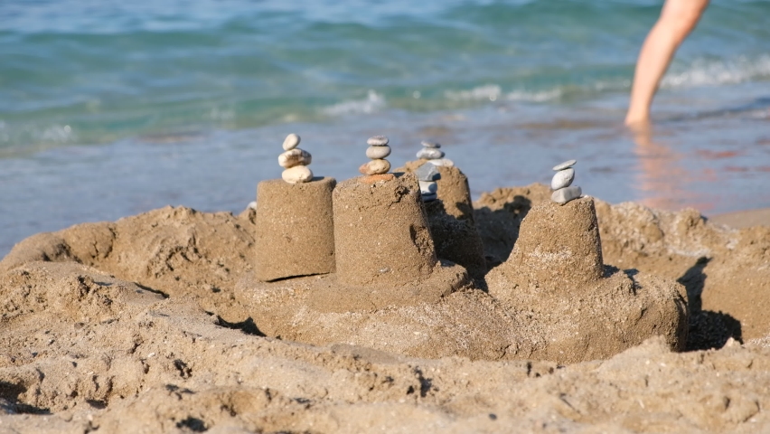 sunlighted sand towers on oceans beach Stock Footage Video (100% ...