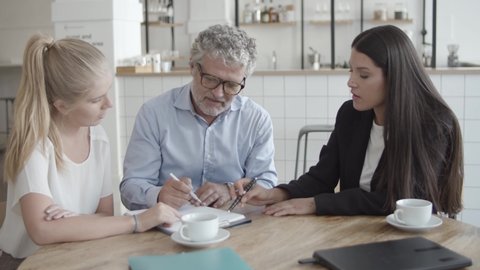 Insurance Agent Helping Customers Complete Form Stock Footage Video ...